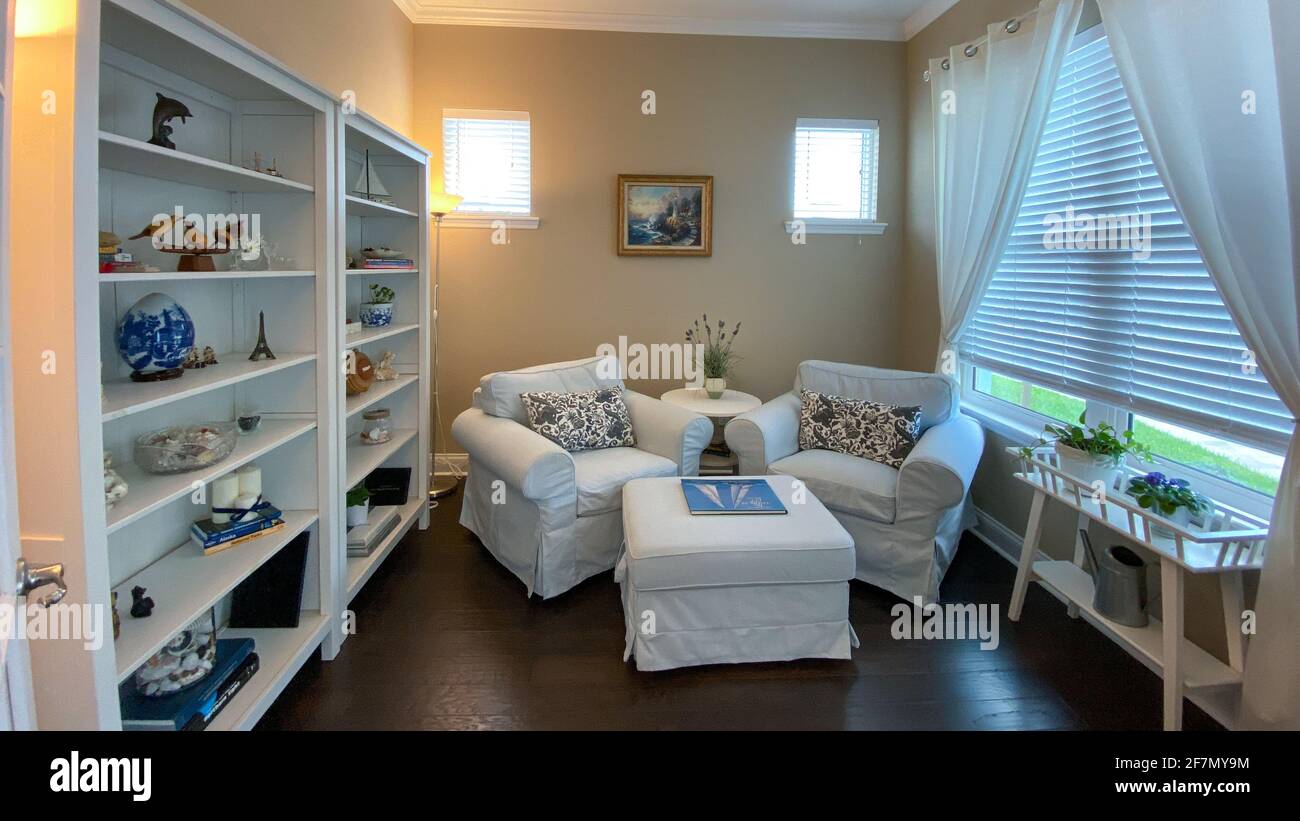 A nicely decorated cozy den in a home that is perfect for reading Stock ...
