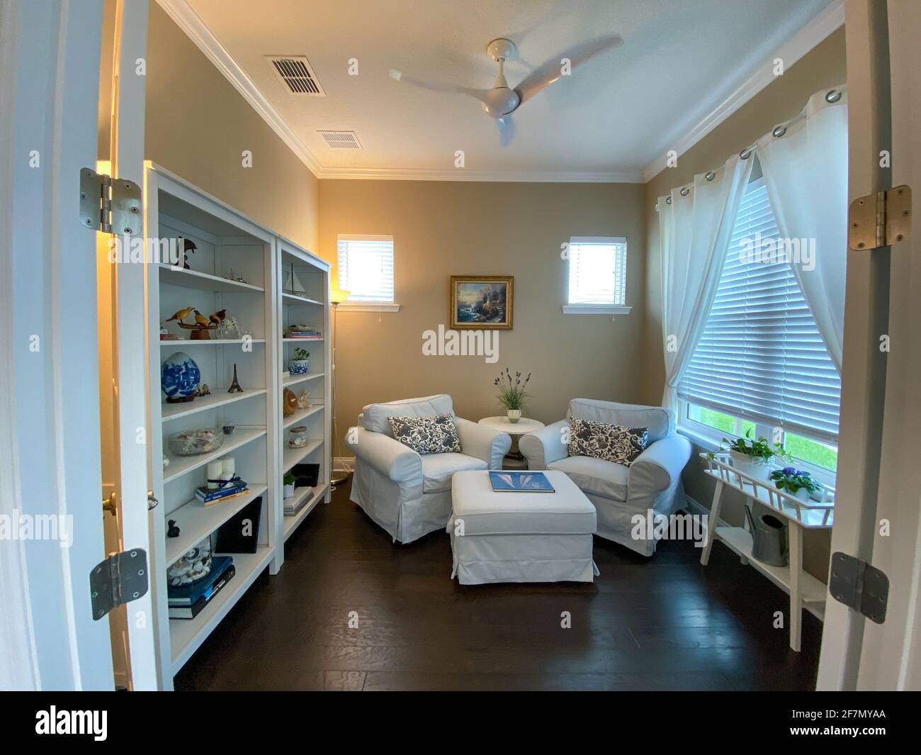 A nicely decorated cozy den in a home that is perfect for reading Stock ...