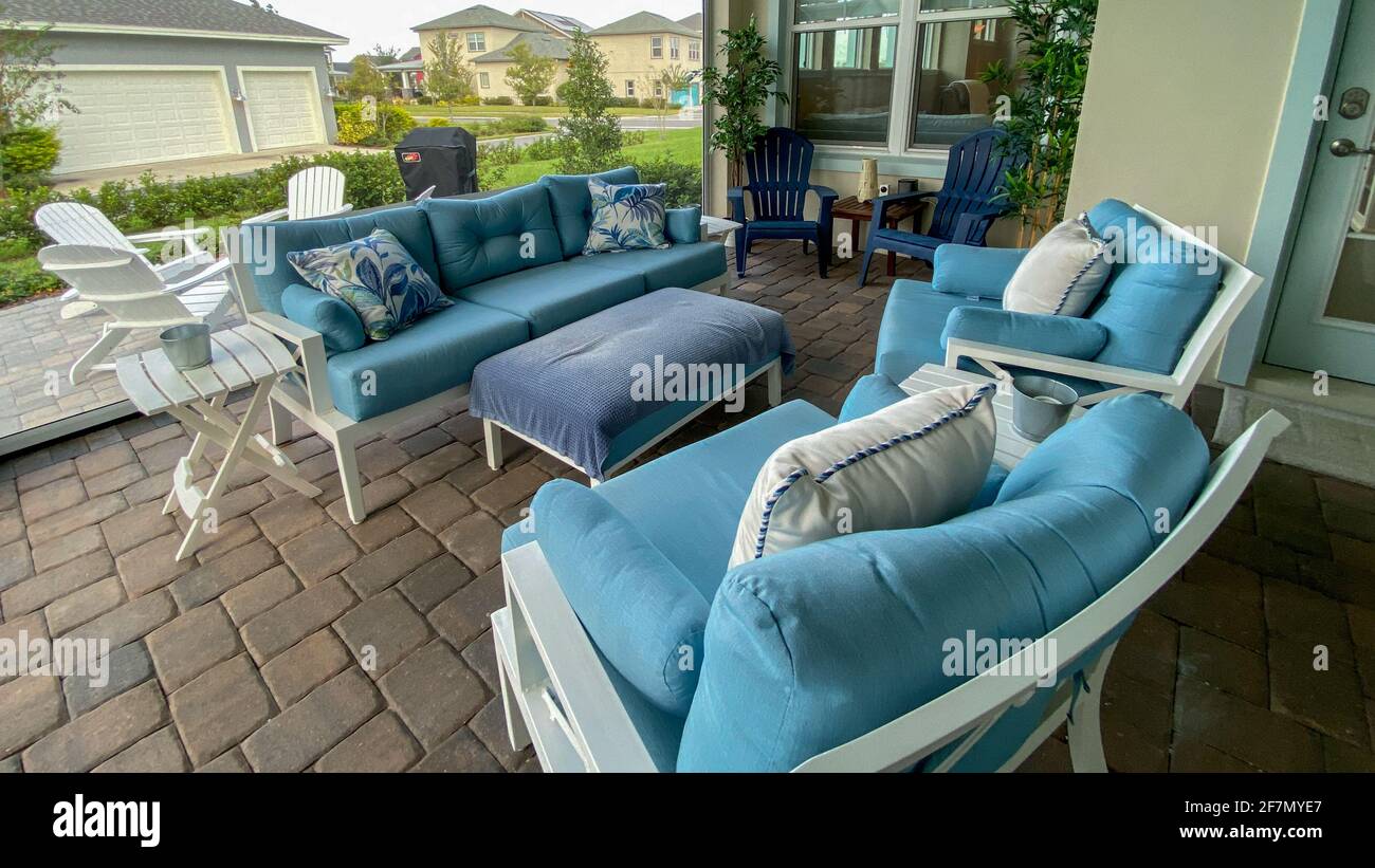 A modern nicely decorated cozy outdoor lanai in a new home in Florida ...