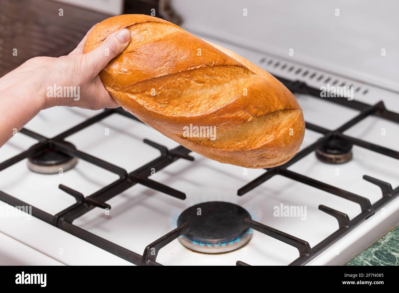 Woman cooking with gas kitchen hi-res stock photography and images - Alamy