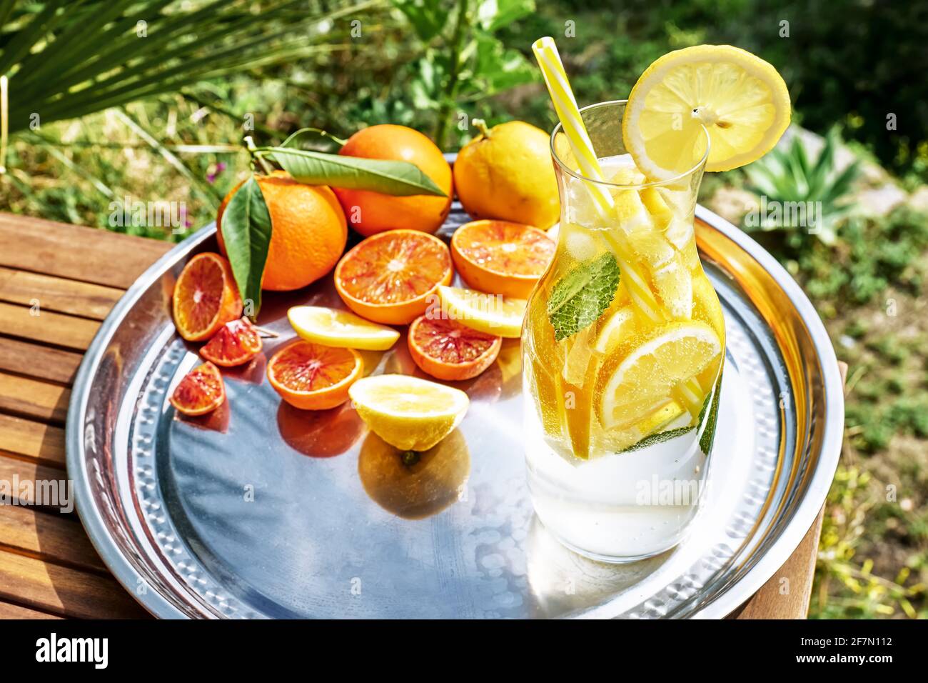 Summer refresh lemon cocktail with ice and ripe bio citrus fuits on ...