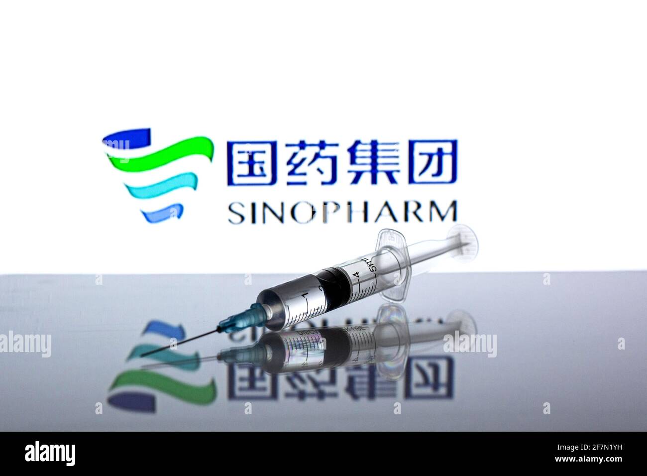 In this photo illustration, a close up of a medical syringe seen displayed in front of the ...