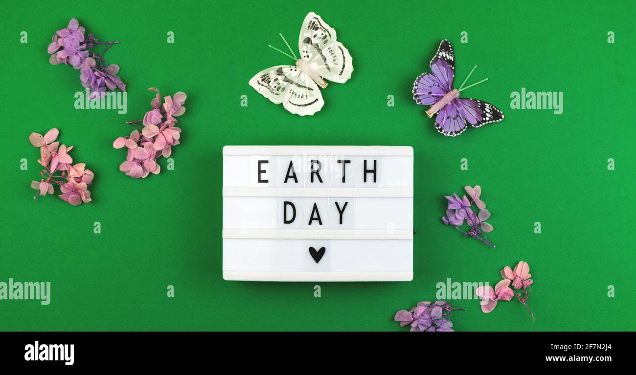 Earth day green concept with lettering on a lightbox, eco friendly ...