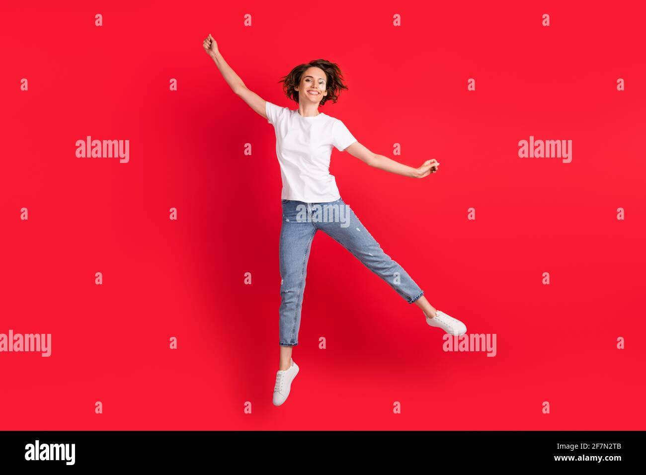 Full length body size view of attractive cheerful skinny girl jumping ...
