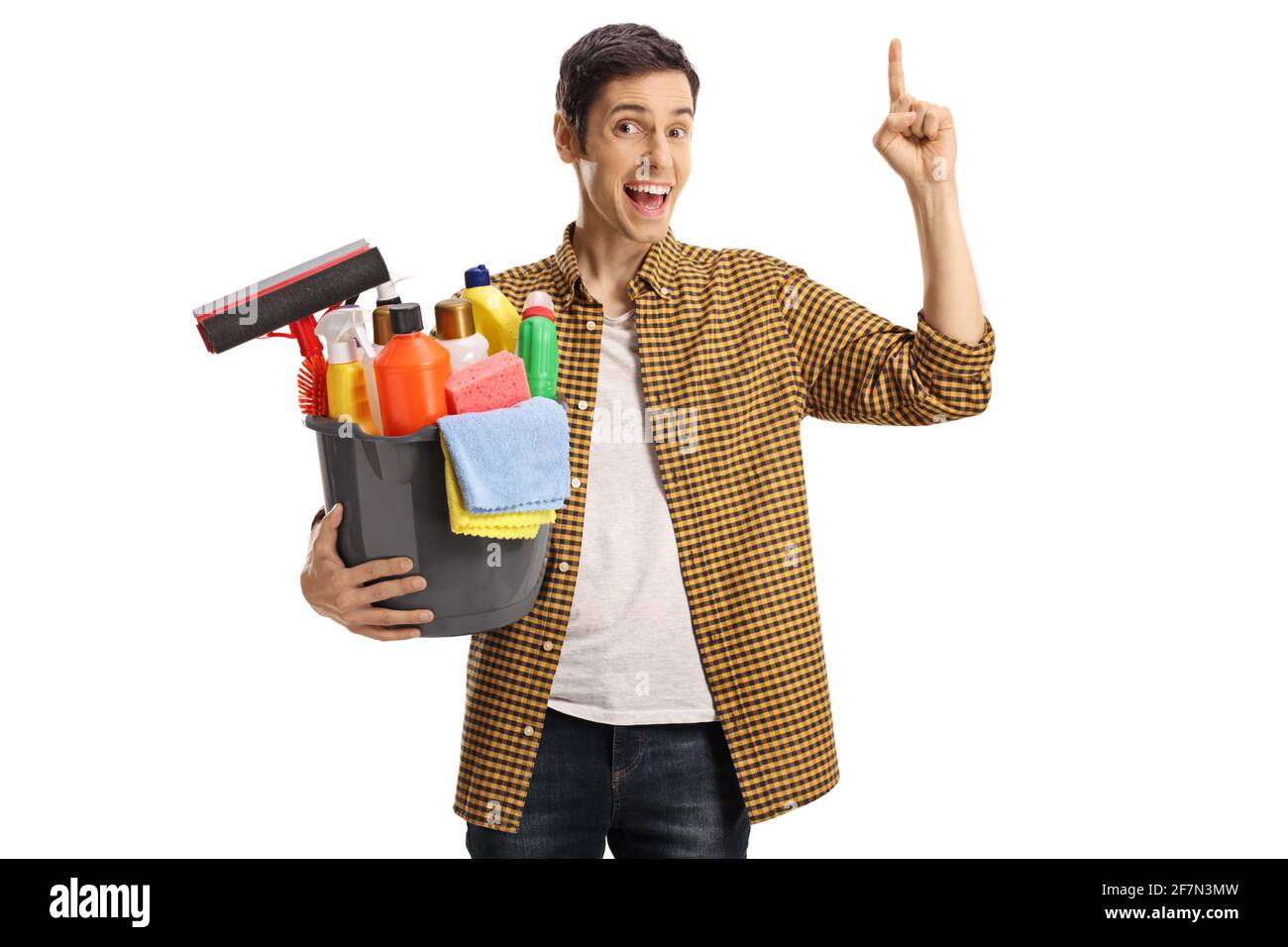 Young man with a cleaning bucket pointing up and looking at camera ...