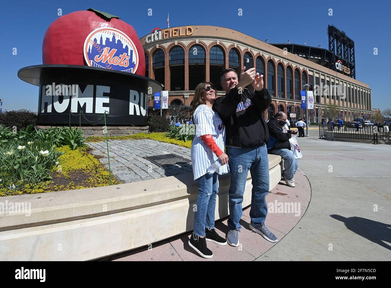 New York, USA. 08th Apr, 2021. Mets fans Rosario and John Bopp take a ...