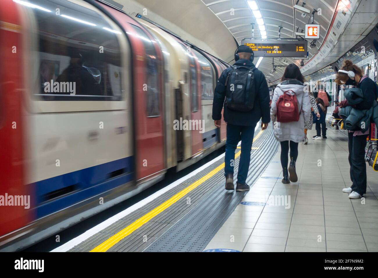 Passengers walk along the platform at Shepherd's Bush London ...