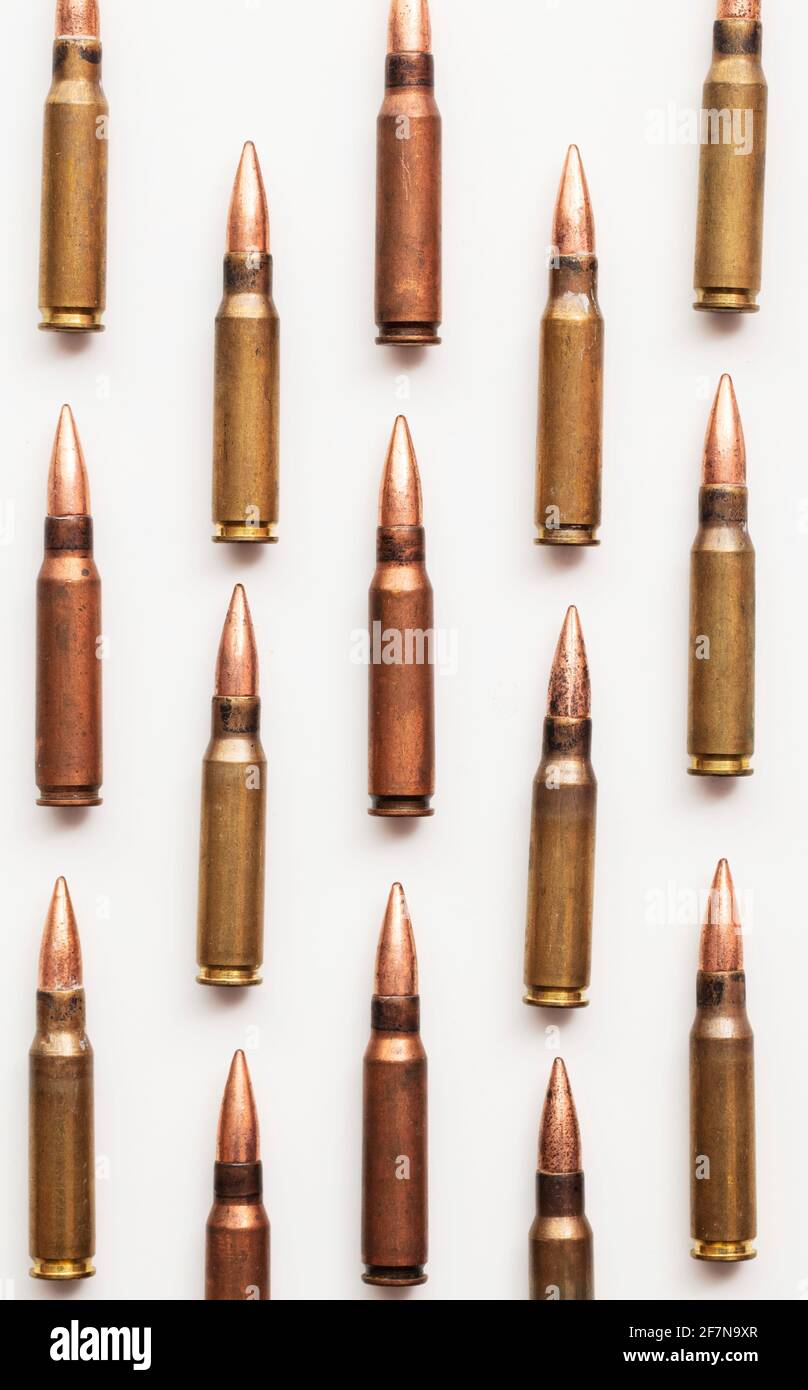 A group of bullet ammunition shells on a white background Stock Photo ...