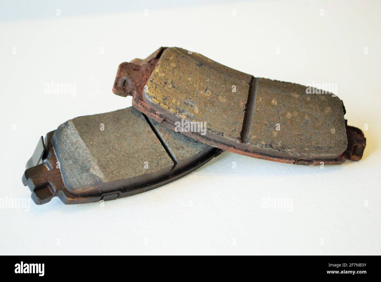 Worn out ruined disc brake pad compared to one that is new Stock Photo ...