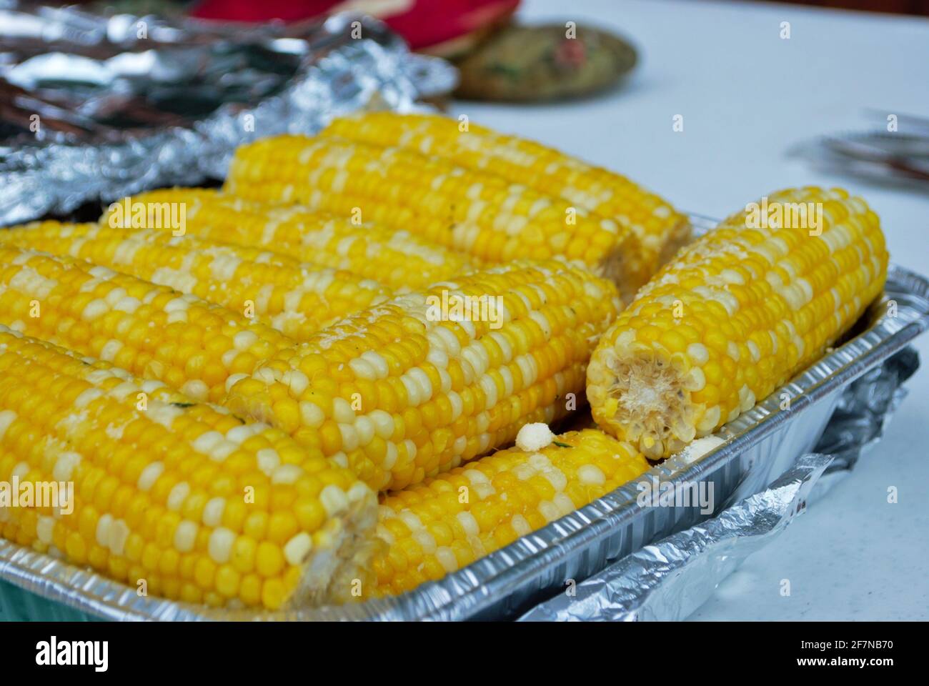 lots of corn on the cob at a family gathering Stock Photo - Alamy