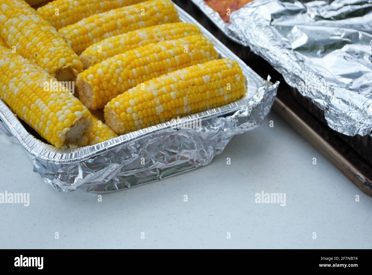 lots of corn on the cob at a family gathering Stock Photo - Alamy