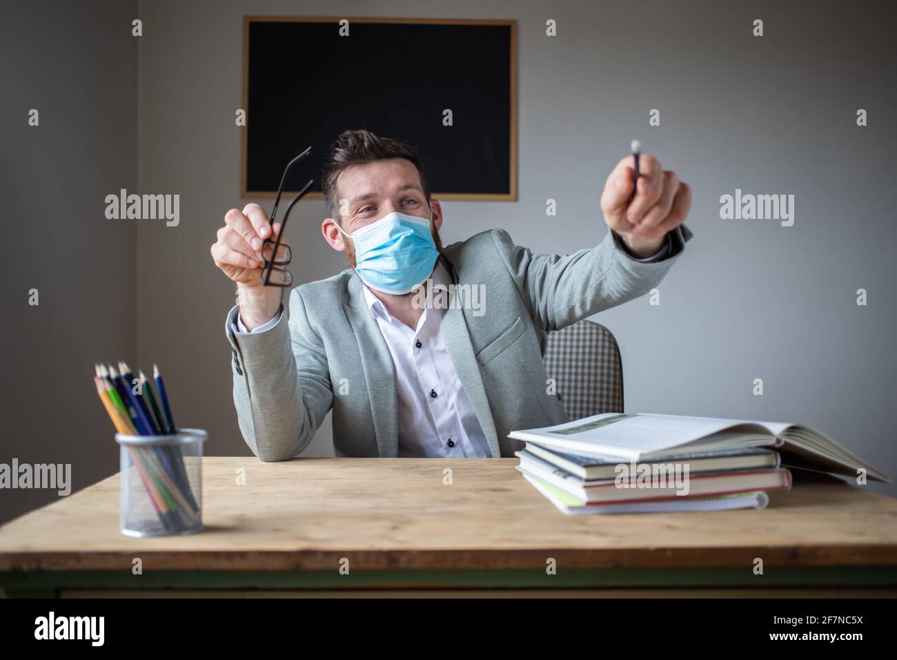 teacher in classroom wearing a medical mask school reopening Stock ...