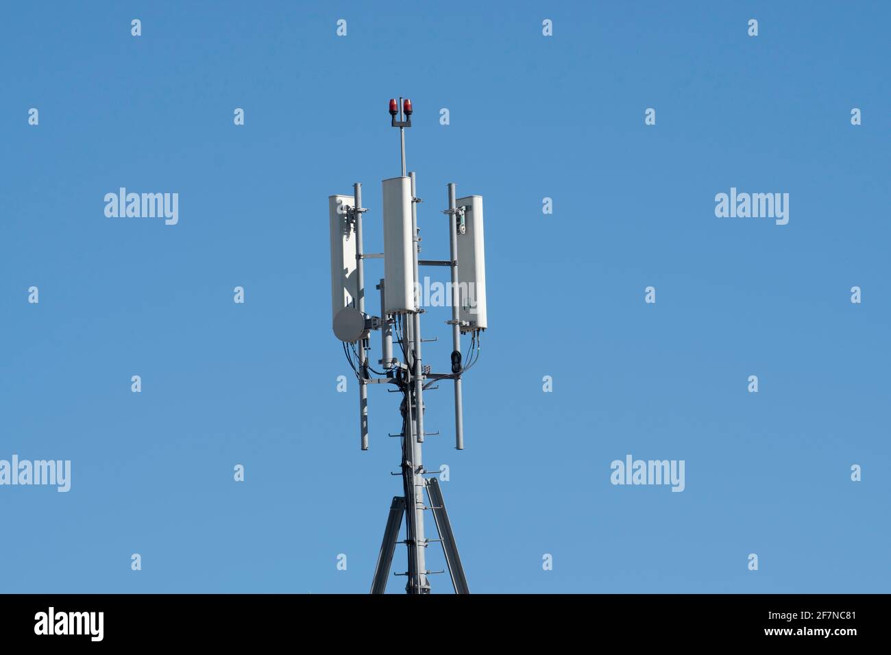 Cellular transmitters on top of building with a blue sky morning Stock ...