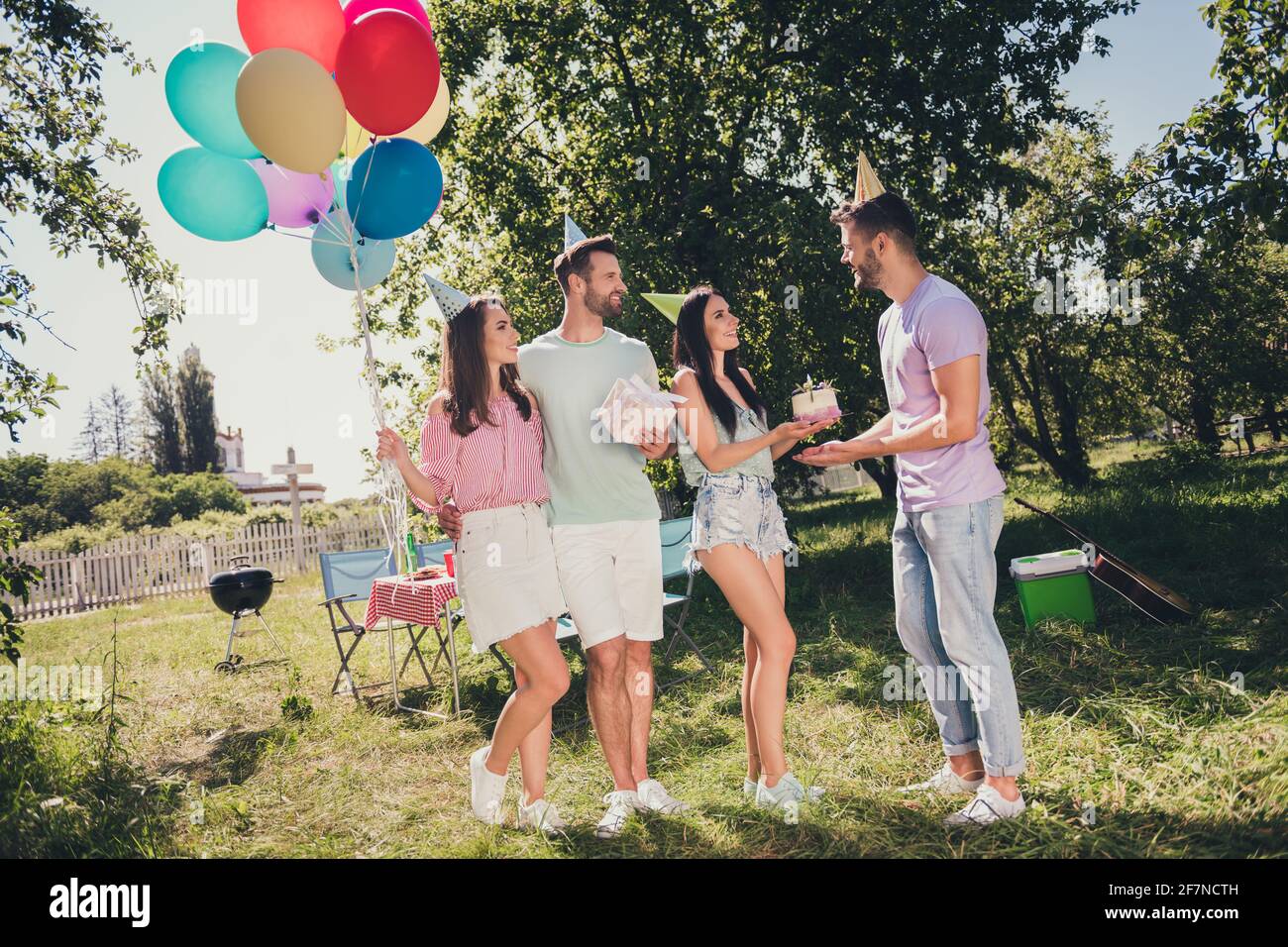 Full length photo of cute company four fellows having birthday party ...