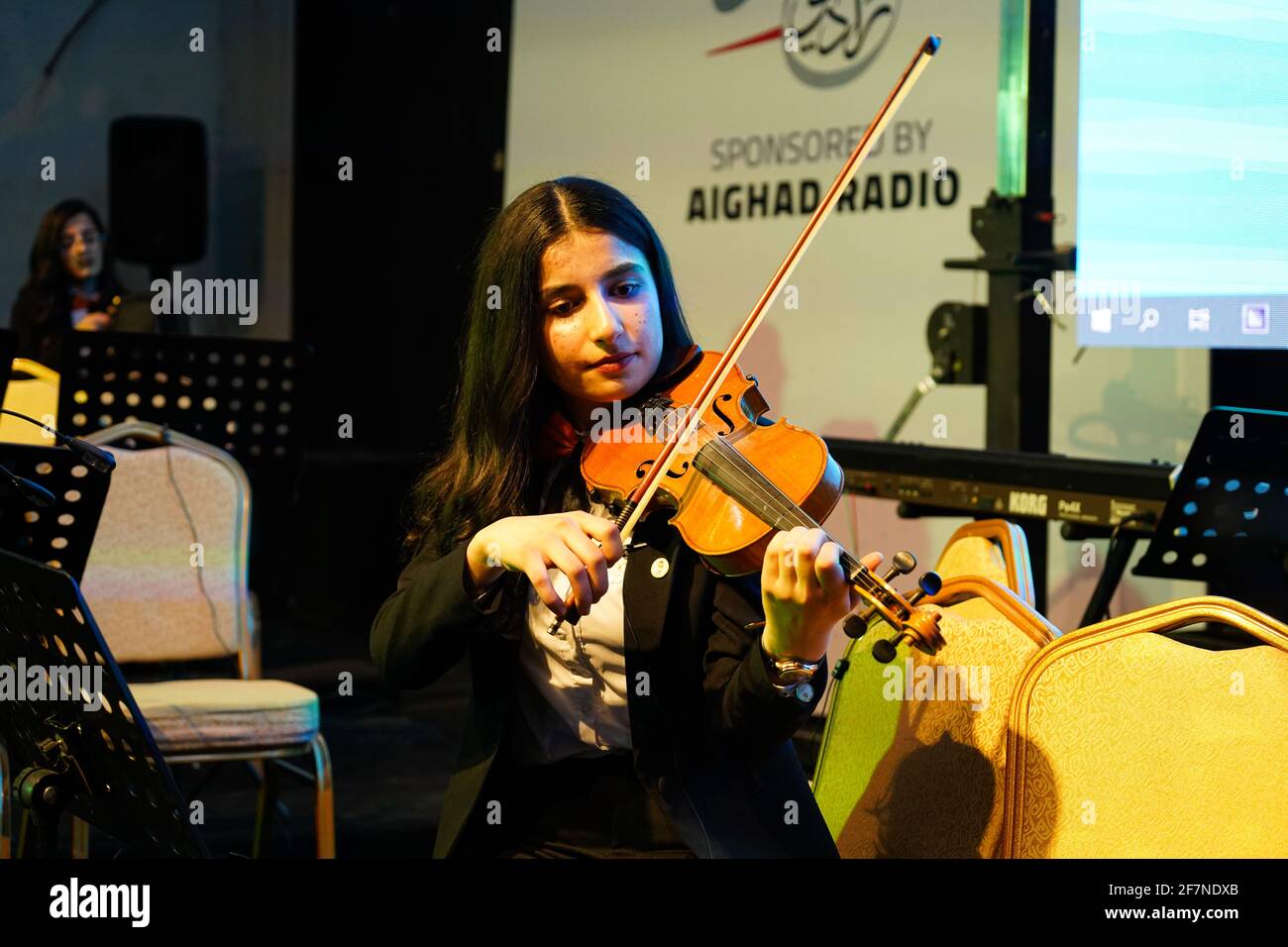 A young lady, member of the Watar orchestra playing for the first time ...