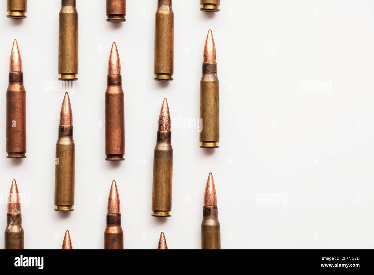 A group of bullet ammunition shells on a white background Stock Photo ...