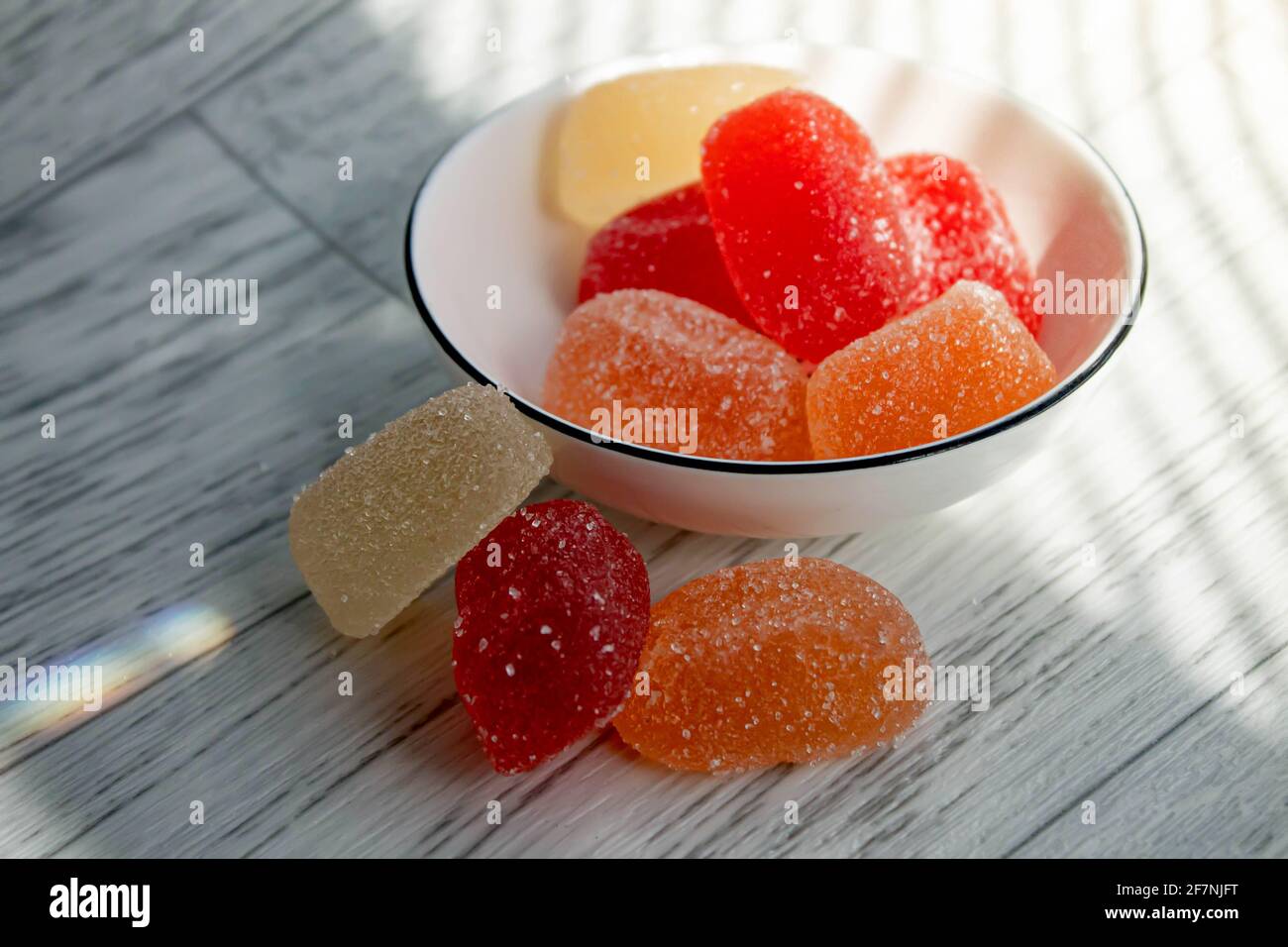 Multi-colored marmalade on the table. Jelly candy with sugar on top ...