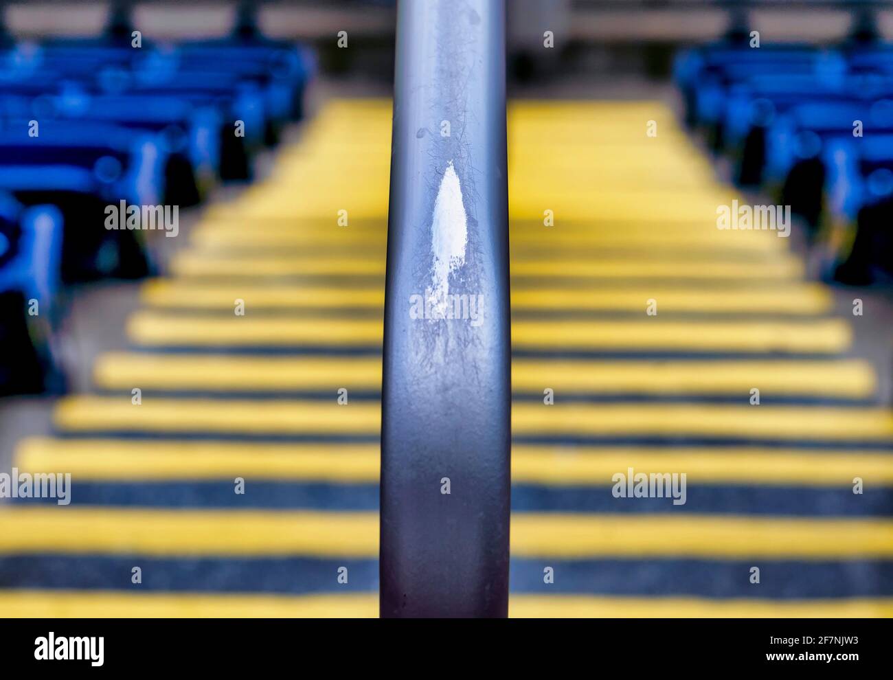 Yellow painted steps leading to stadium seating Stock Photo - Alamy