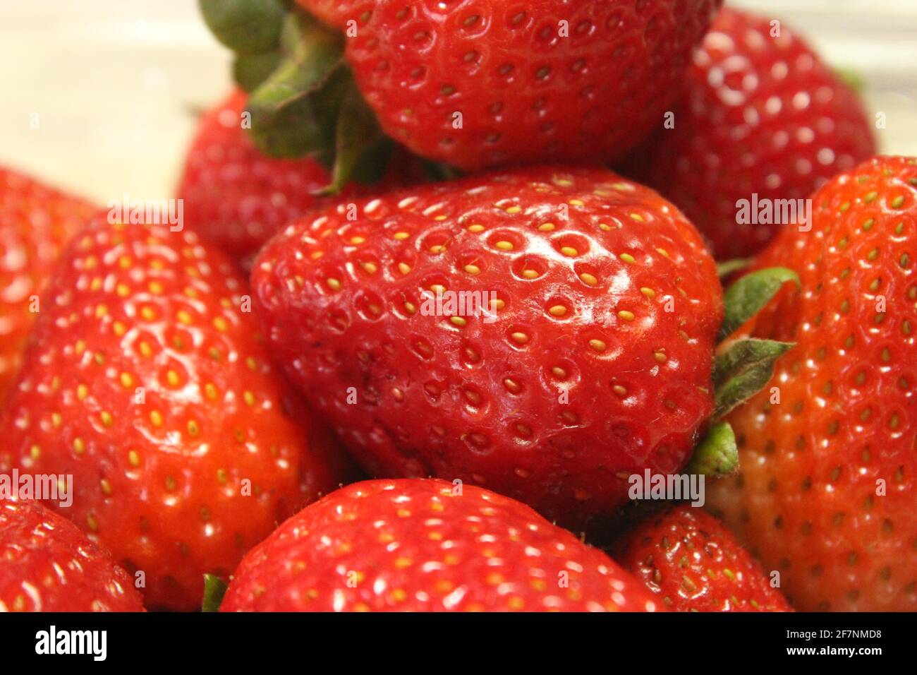 A group of strawberries on display Stock Photo - Alamy