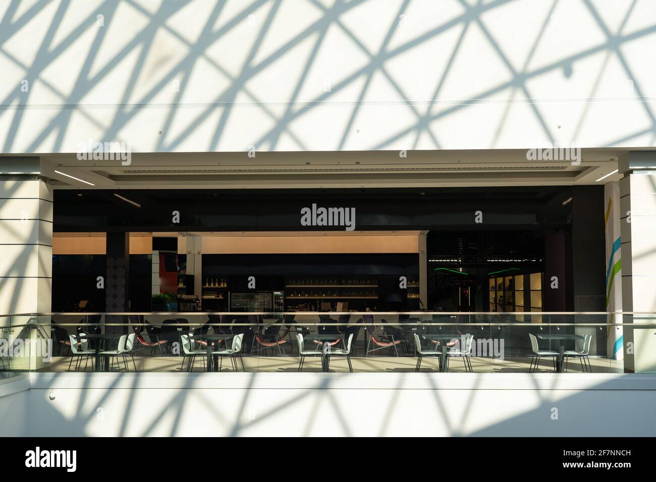 View on food court in a modern shopping mall with tratsparent glass ...