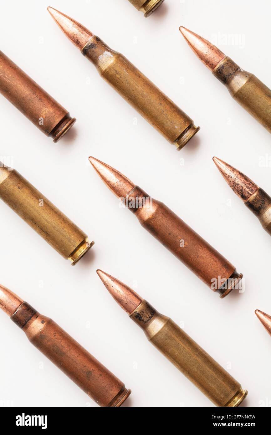 A group of bullet ammunition shells on a white background Stock Photo ...