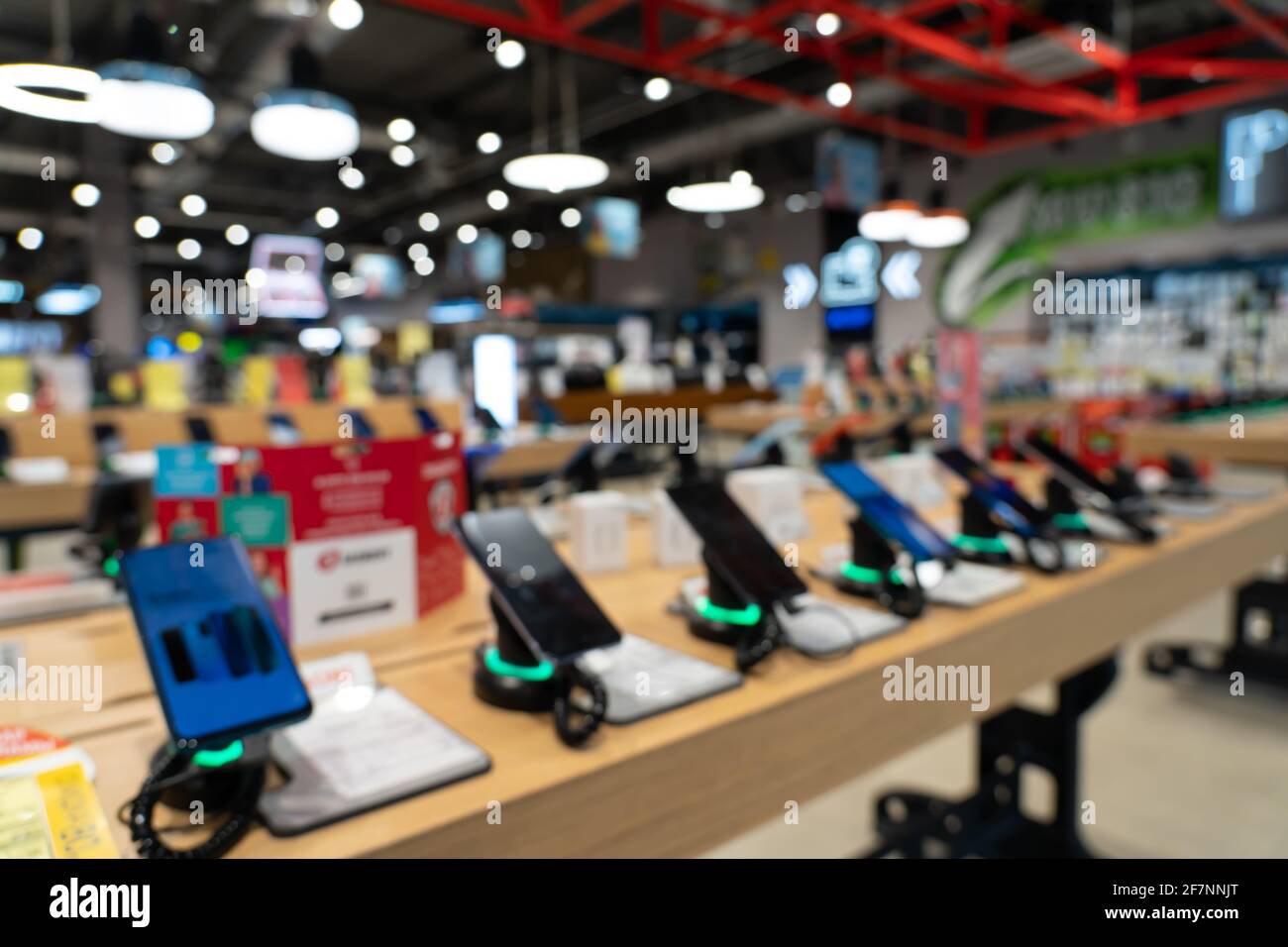 Showcase with smartphones in the modern electronics store. Buy a mobile ...