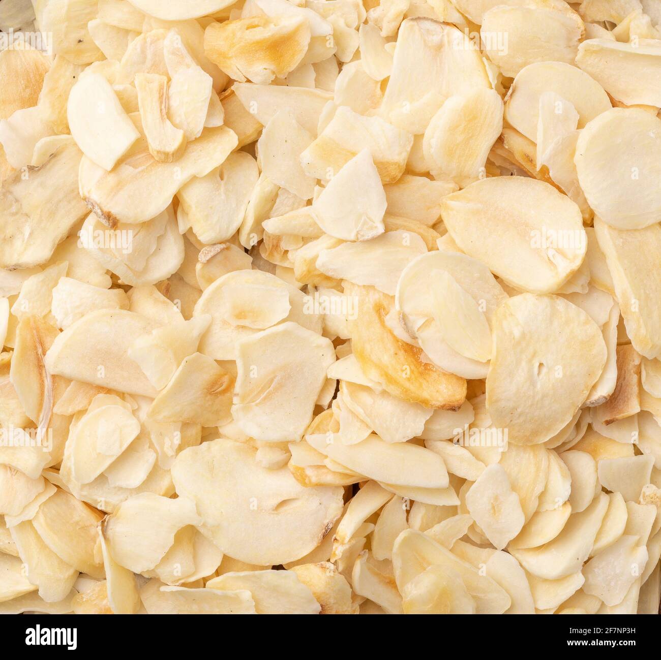 Top view, closeup of dried garlic slices. Food backdrop Stock Photo - Alamy