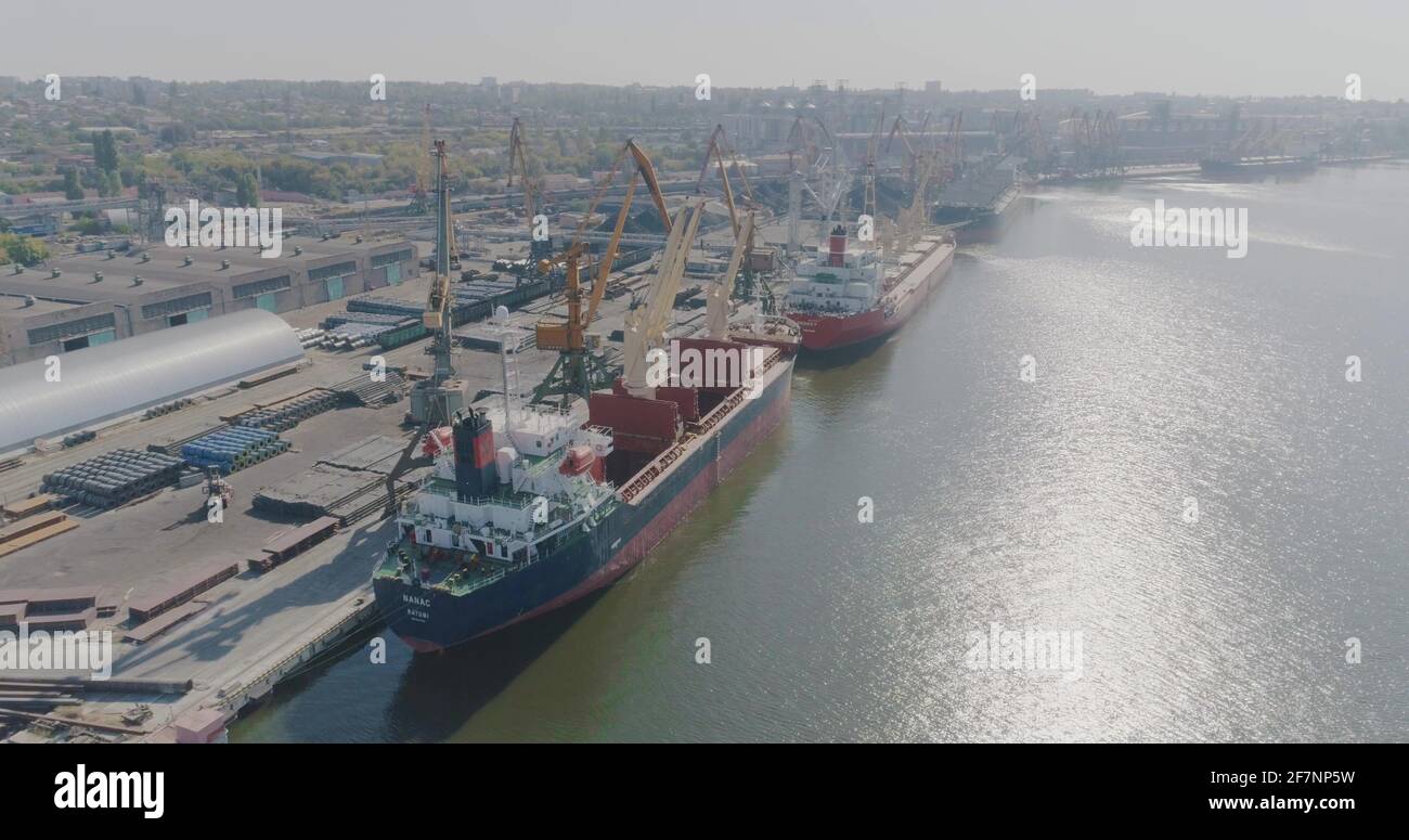 Large cargo ships in the seaport. Commercial port with large cargo ...