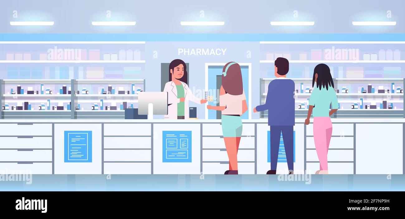 female doctor pharmacist giving pills to mix race customers patients at ...