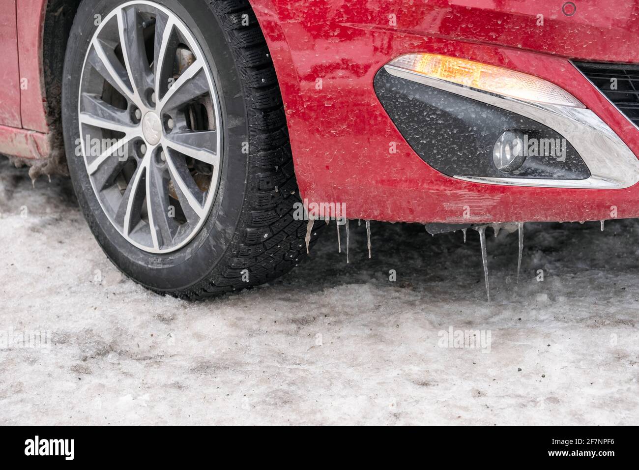 Front of red car covered with snow and frost in blizzard Stock Photo ...