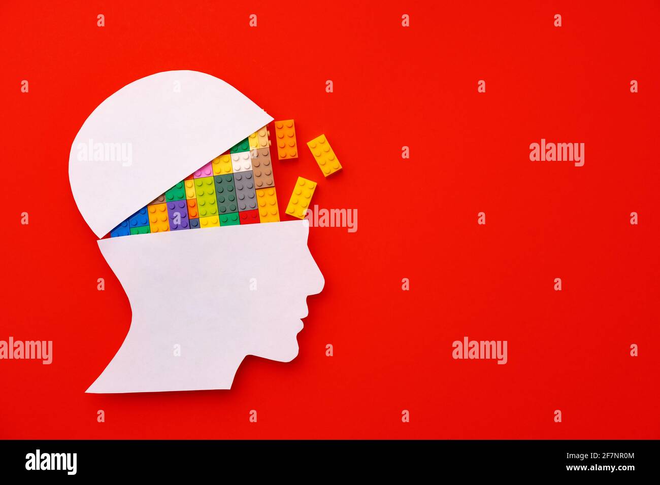 Papercut silhouette of human head with colorful constructor pieces ...