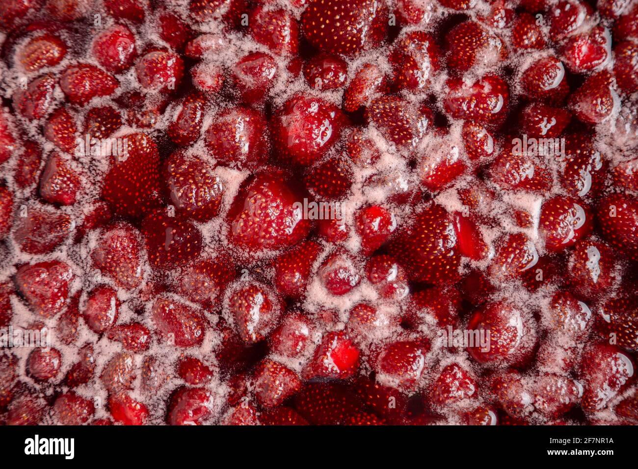 Strawberry jam is boiling, detailed shooting. Close-up of strawberry ...