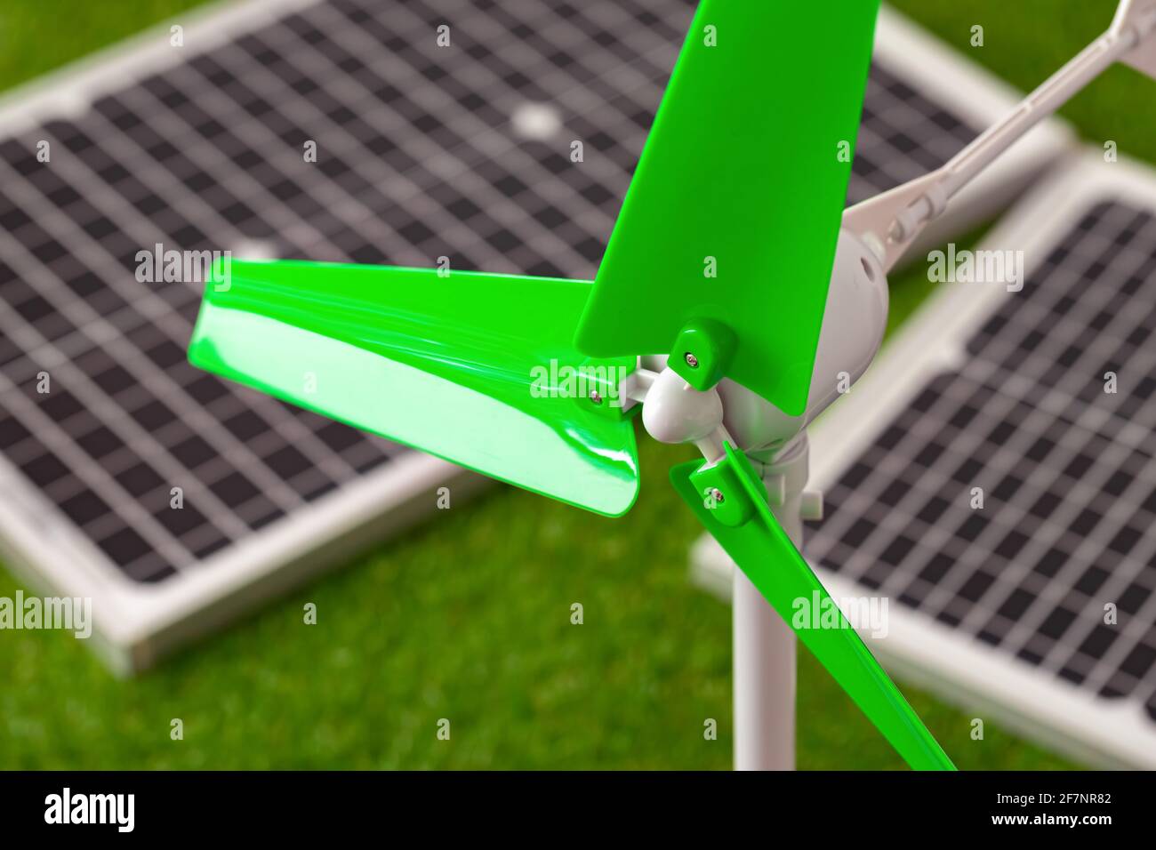 Models of windmill and solar panel, alternative energy sources Stock ...