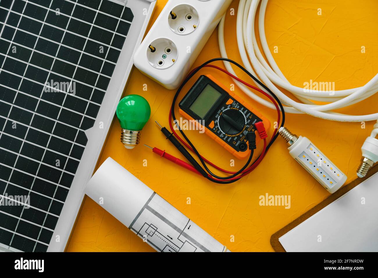 Blueprint roll and solar panel, home project Stock Photo - Alamy