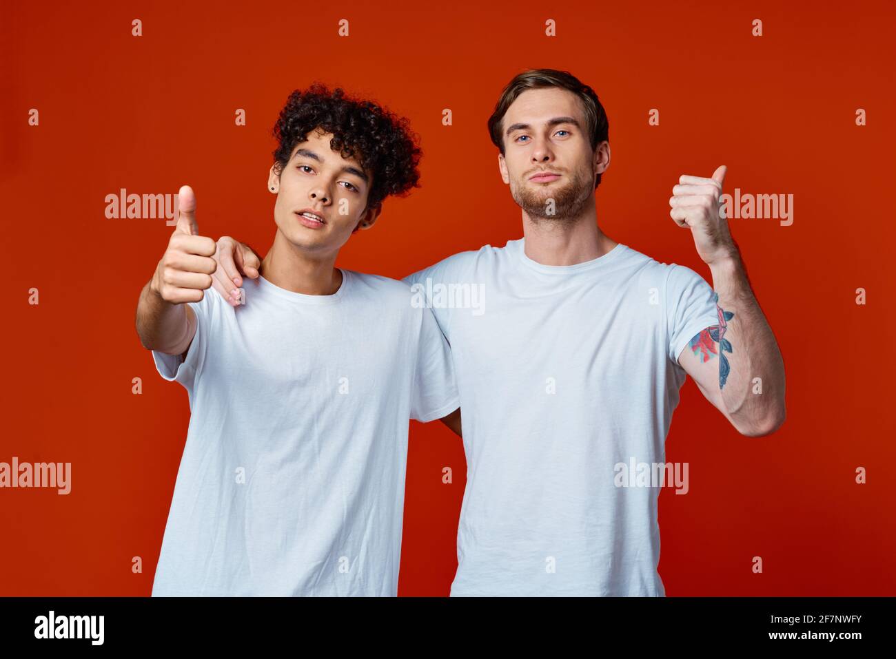 two men stand side by side fun friendship team Stock Photo - Alamy