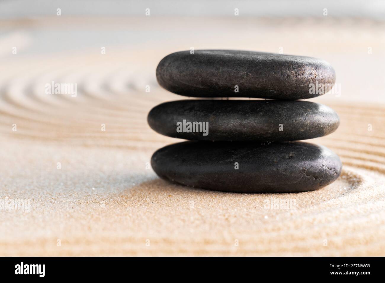 Japanese zen garden with stone in raked sand Stock Photo - Alamy