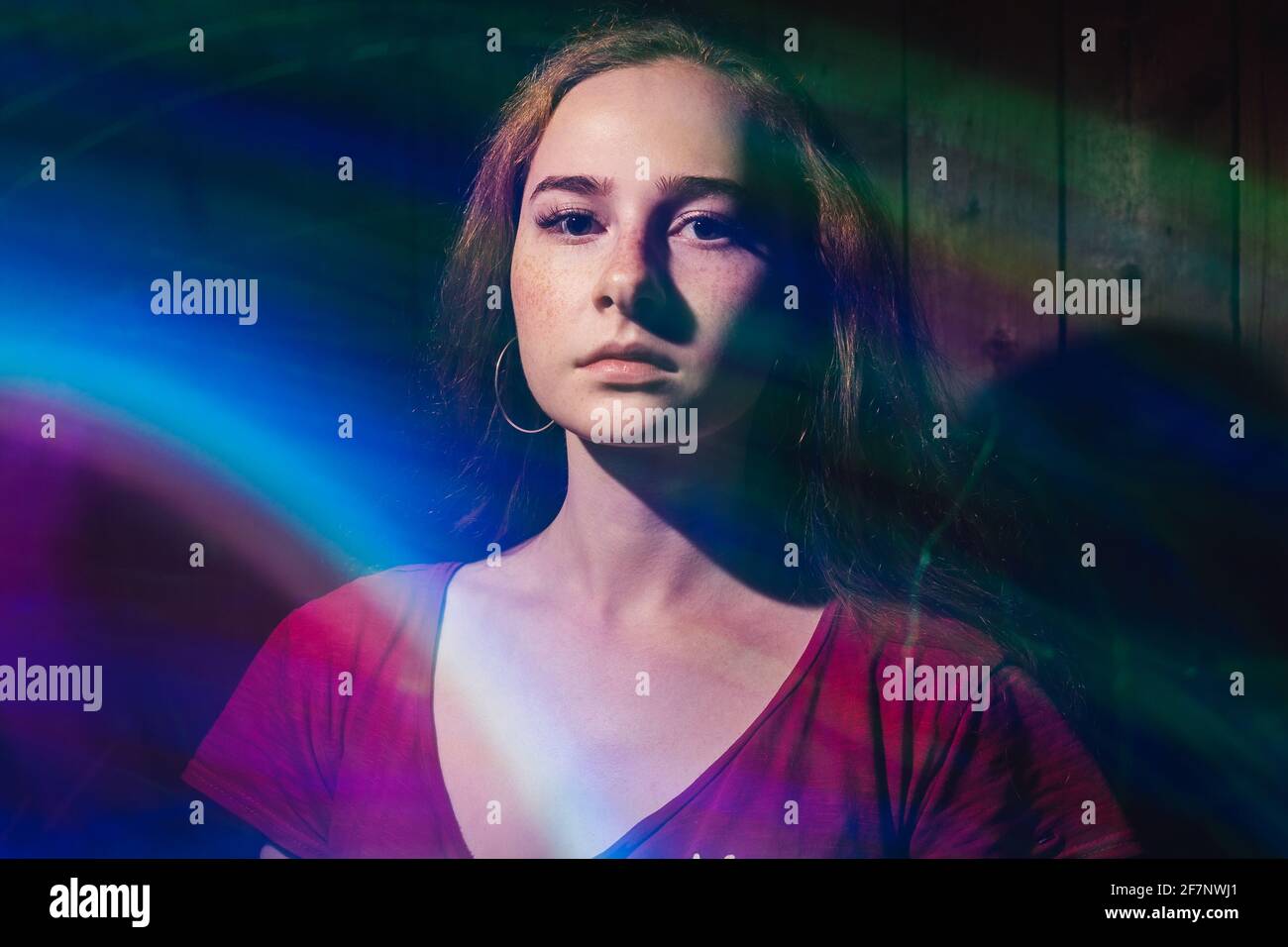 Strange portrait of beautiful cheerful redhead woman. Motion light ...