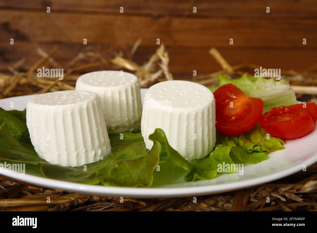 Italian cheese - goat's milk ricotta placed on a sheet of salad leaves ...