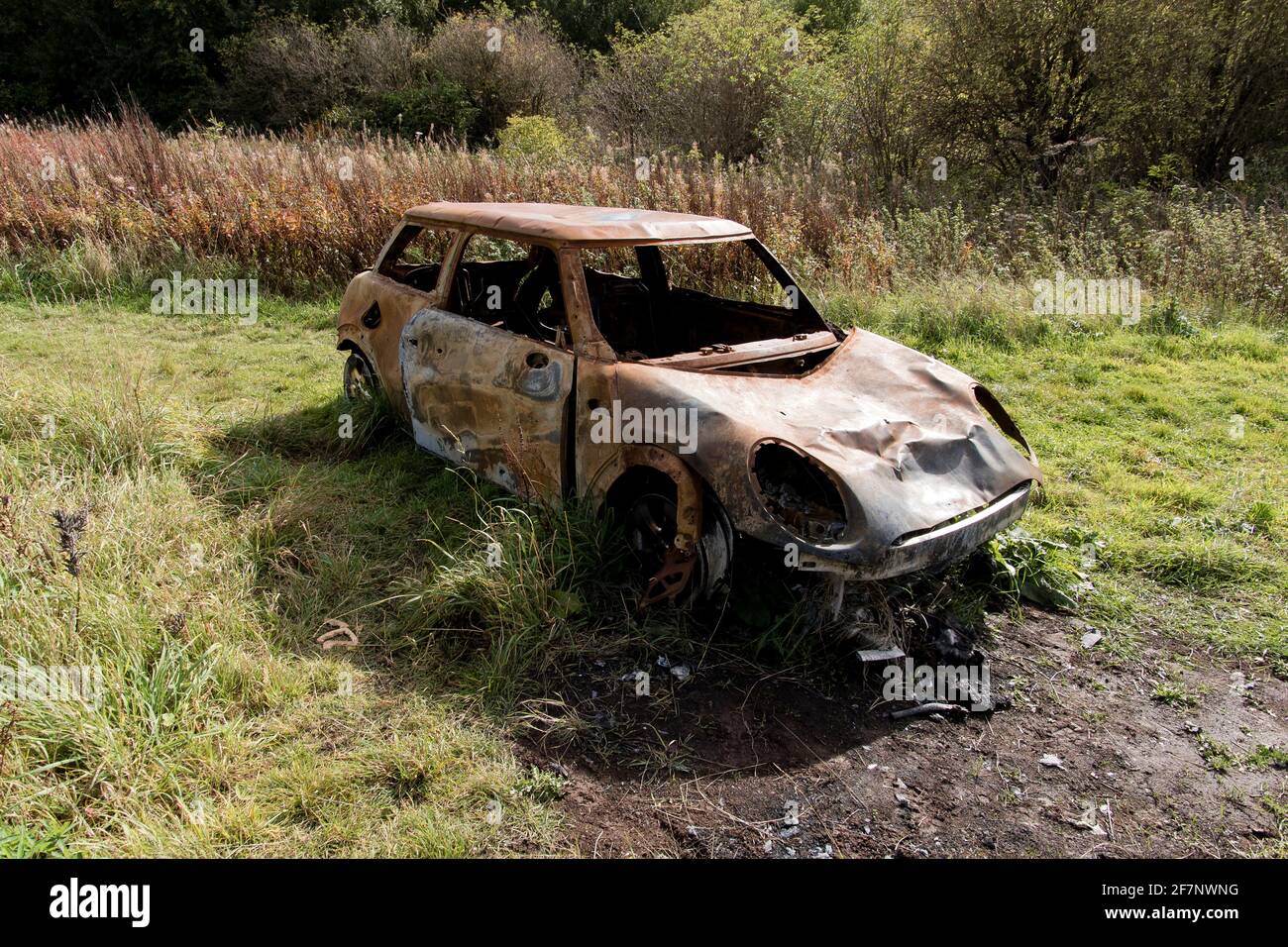 Stolen & dumped car Stock Photo - Alamy