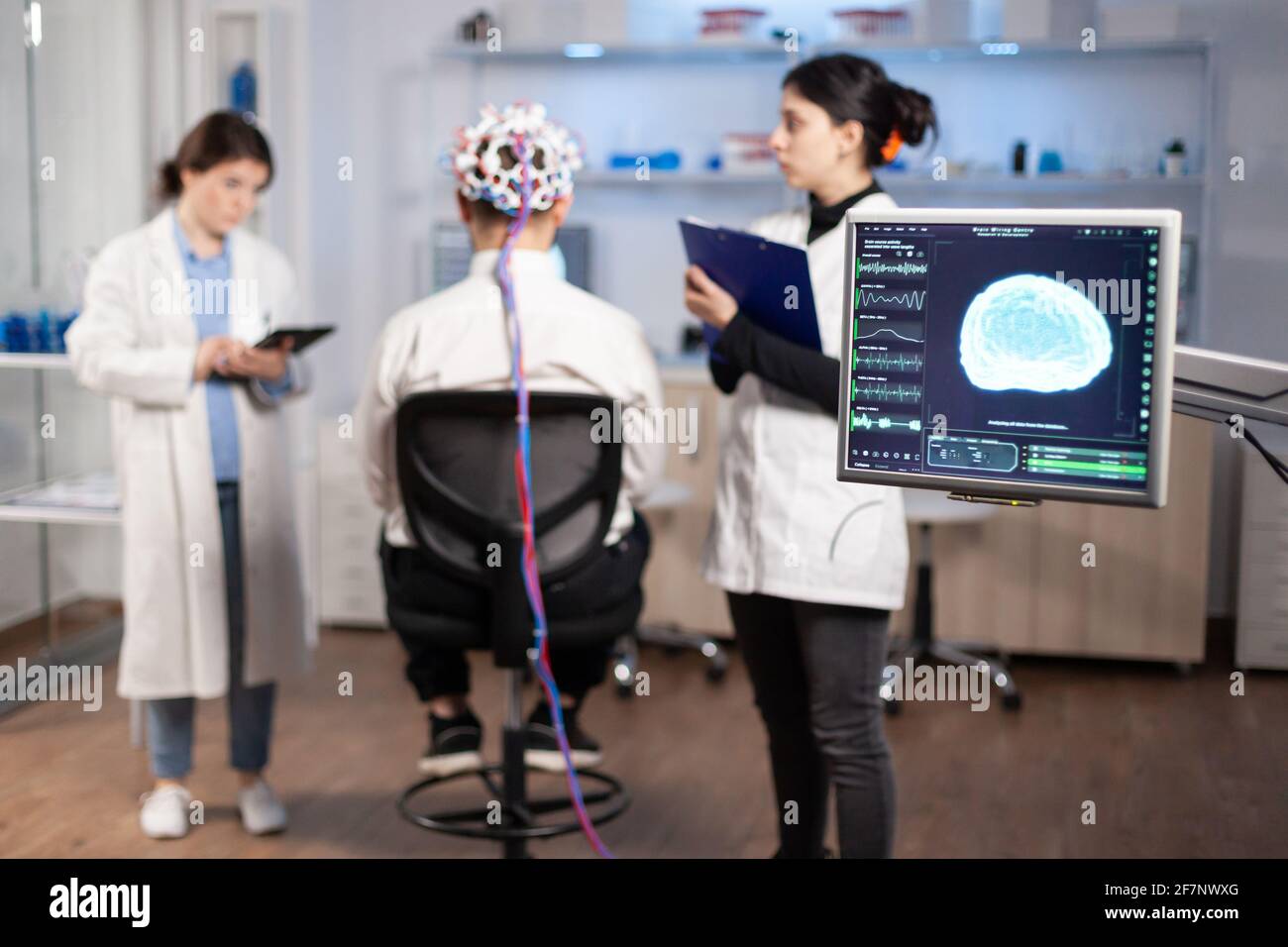 Man patient wearing performant eeg headset scanning brain electrical ...