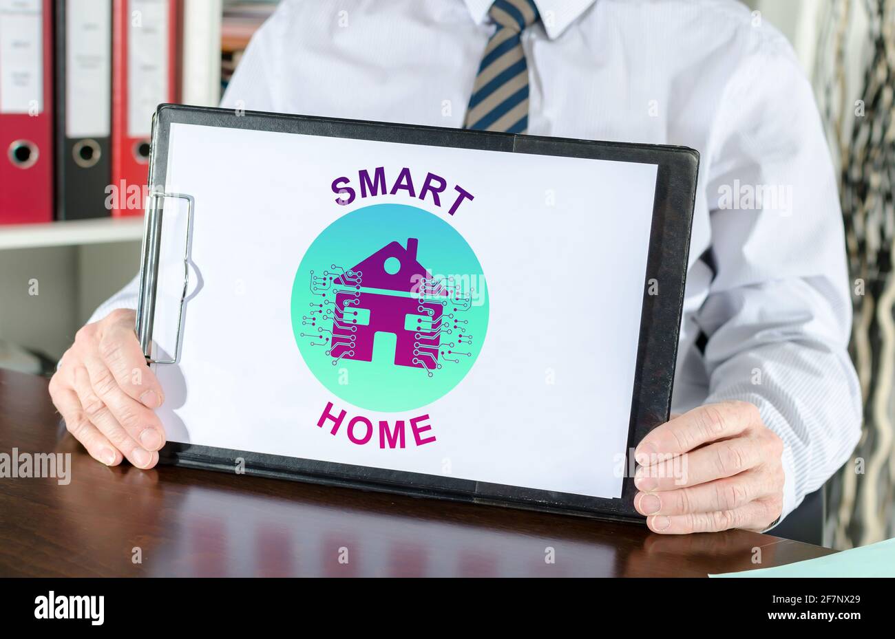 Smart home concept shown by a businessman Stock Photo - Alamy