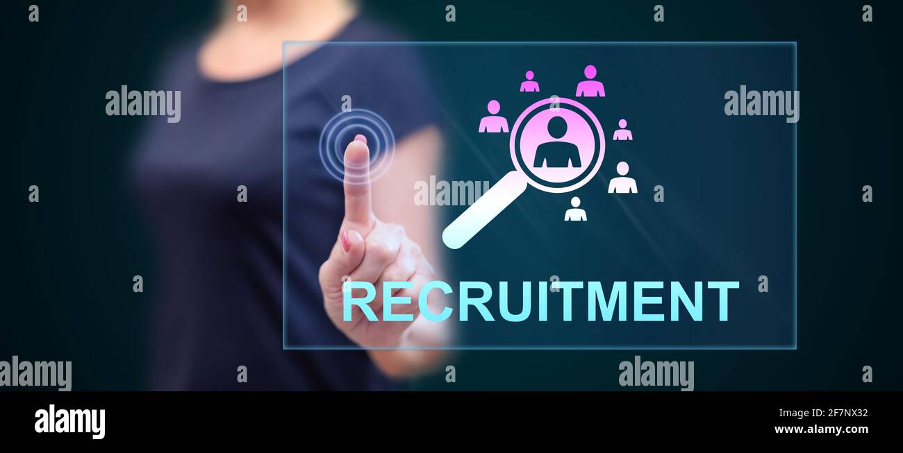 Woman touching a recruitment concept on a touch screen with her finger ...
