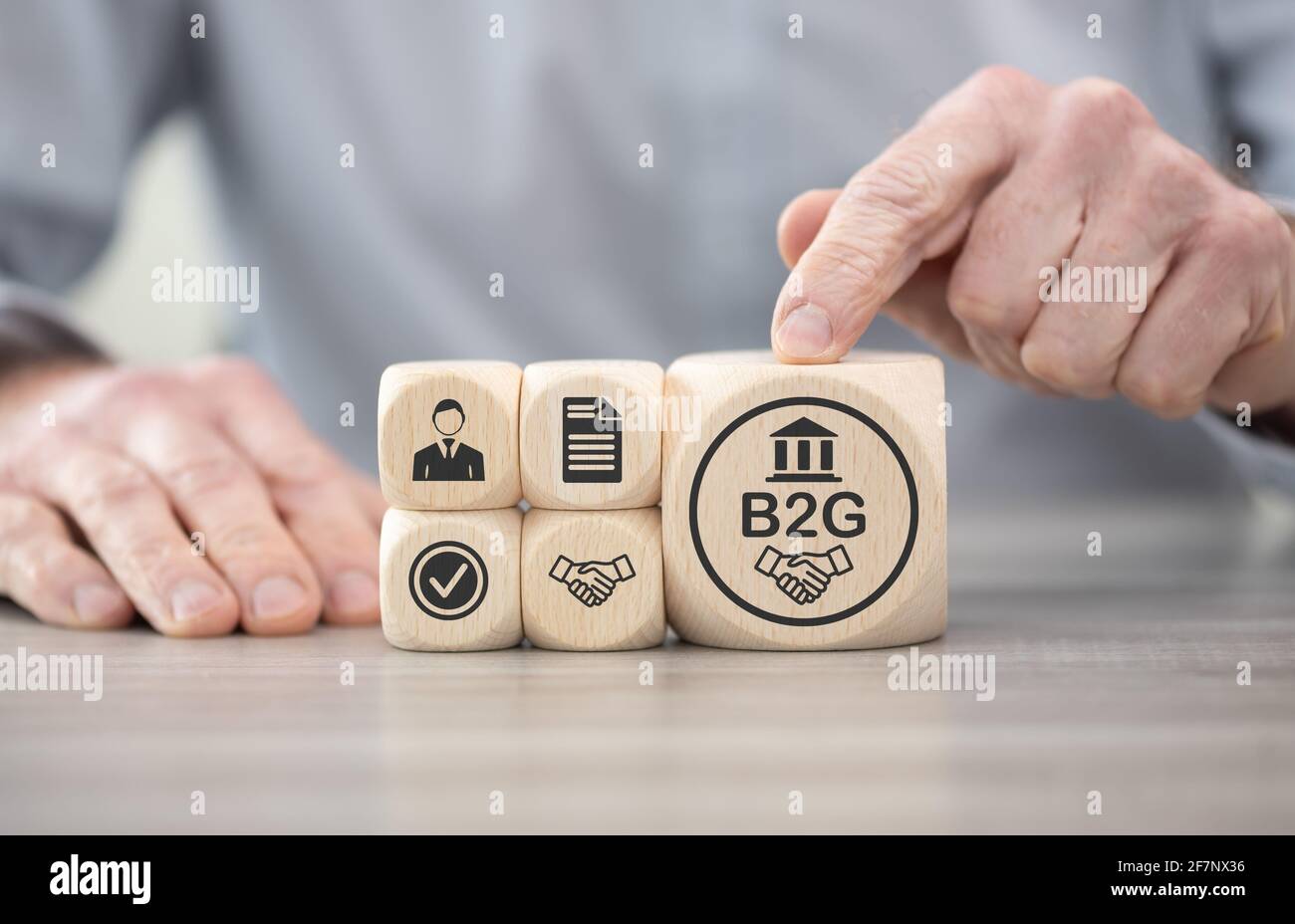 Wooden blocks with symbol of b2g concept Stock Photo - Alamy