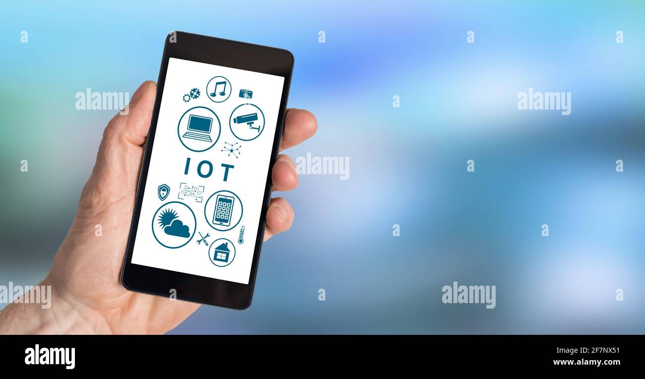 Hand holding a smartphone with iot concept Stock Photo - Alamy