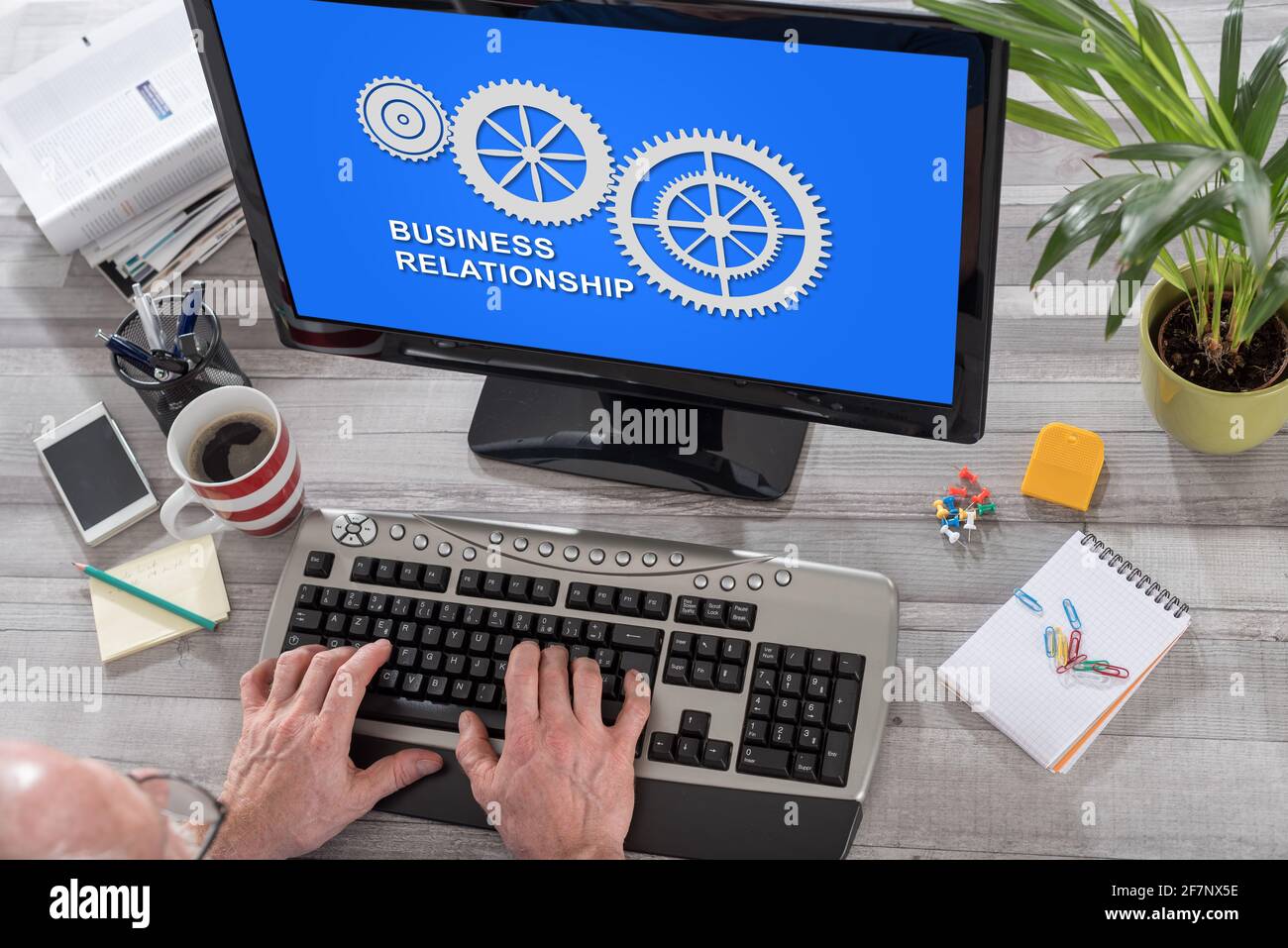 Man using a computer with business relationship concept on the screen ...