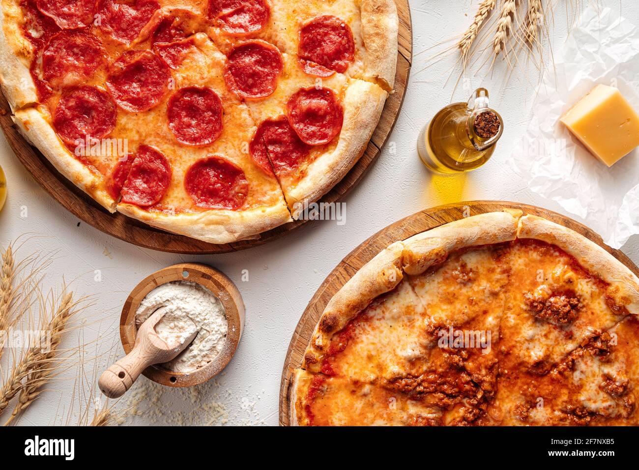 Top view on pizzas with minced meat and pepperoni Stock Photo - Alamy