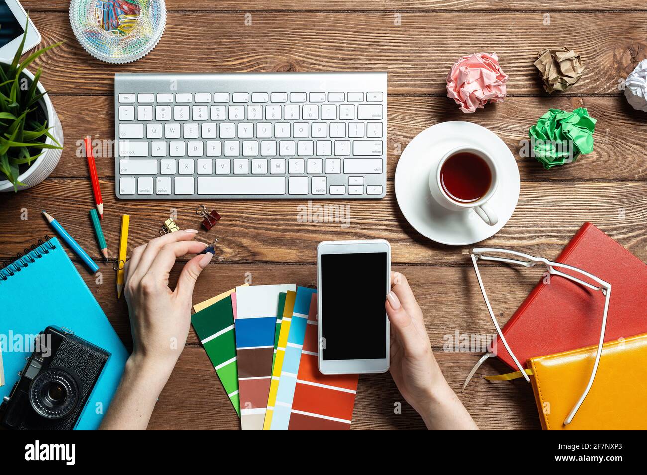 Web designer choosing colors from swatches Stock Photo - Alamy
