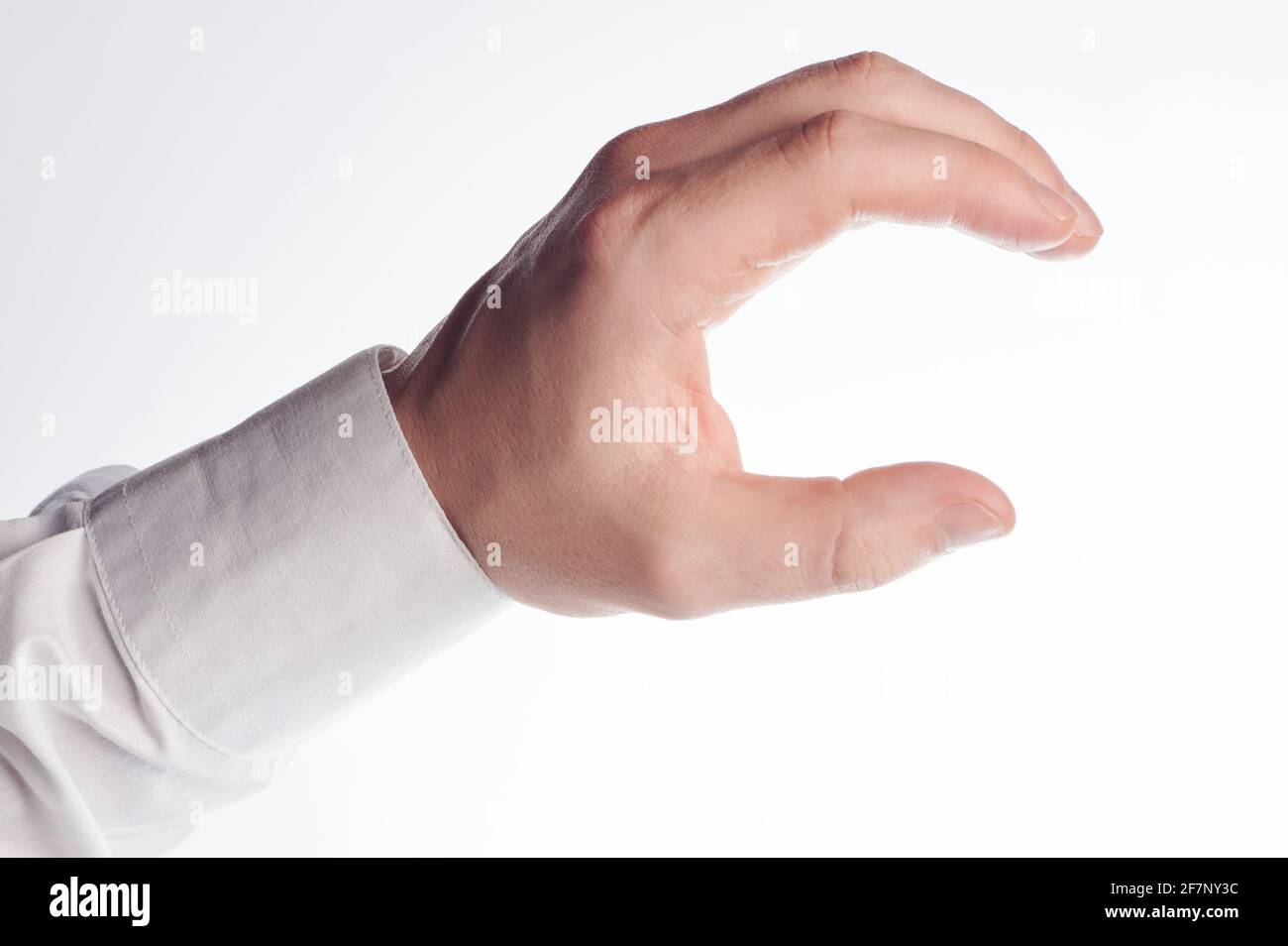 Hand in holding shape pose above top view isolated Stock Photo - Alamy