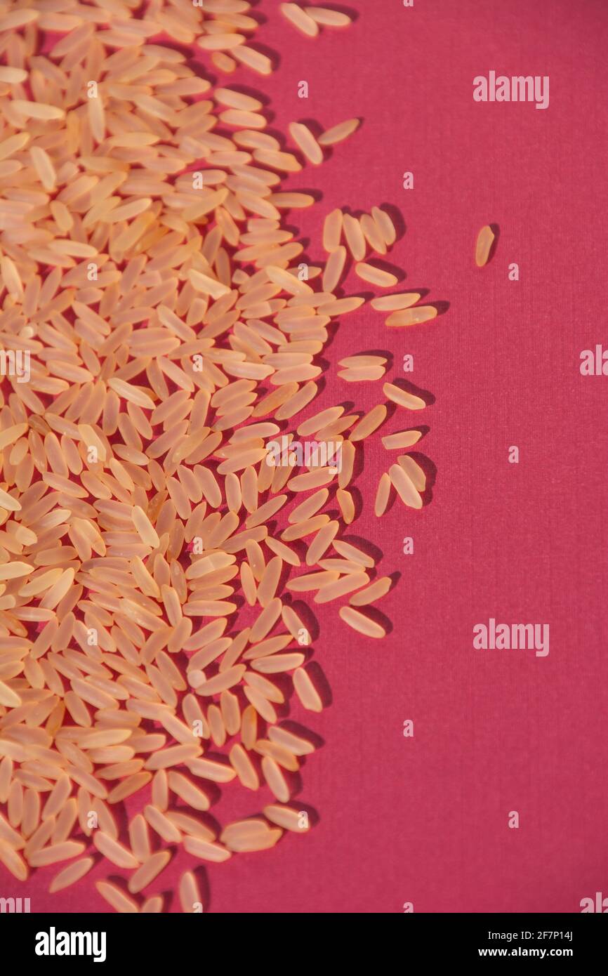 raw and dry natural parboiled rice with rices background Stock Photo ...