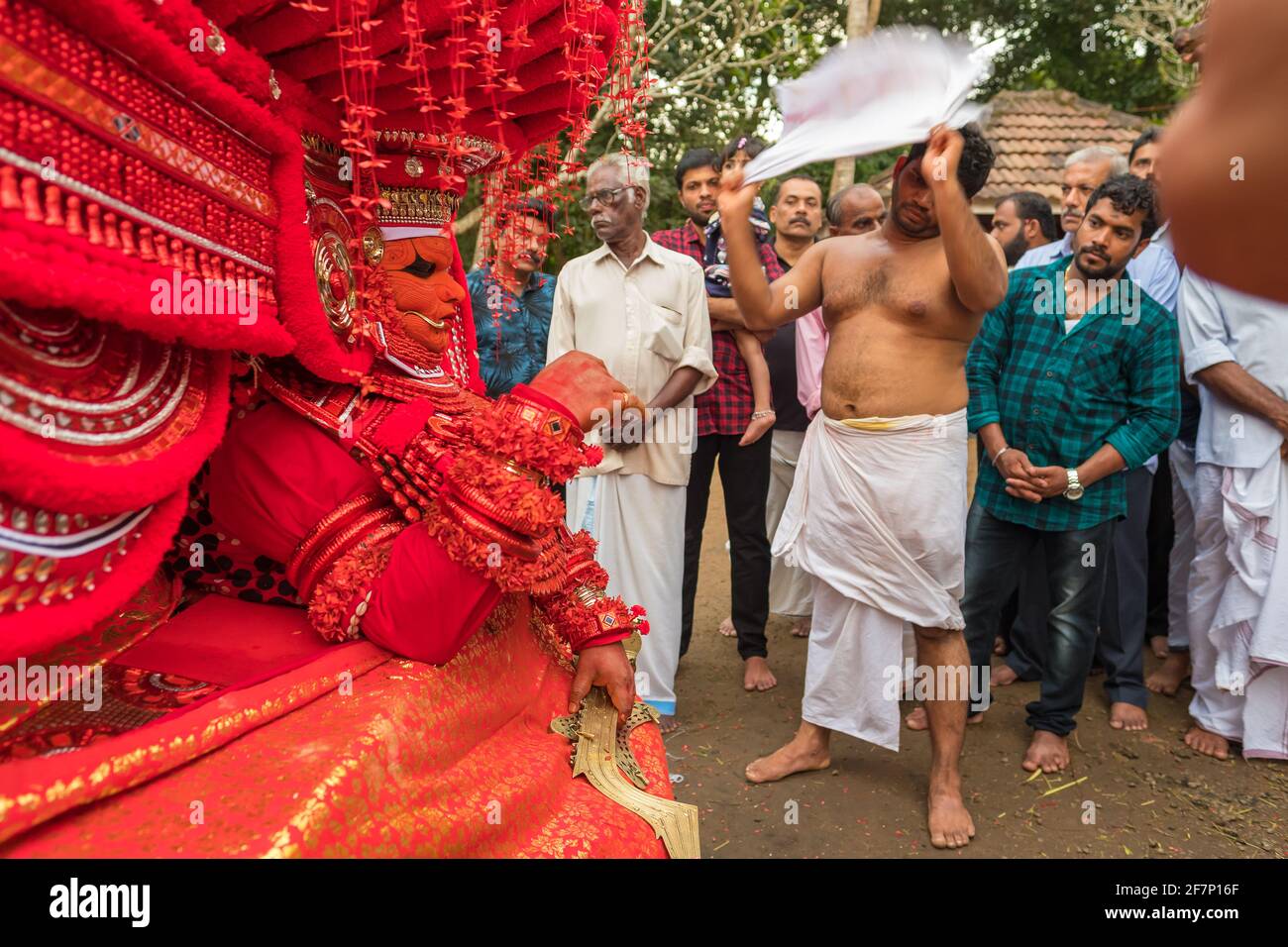 Kannur, India - December 2, 2019: Theyyam artist perform during temple ...